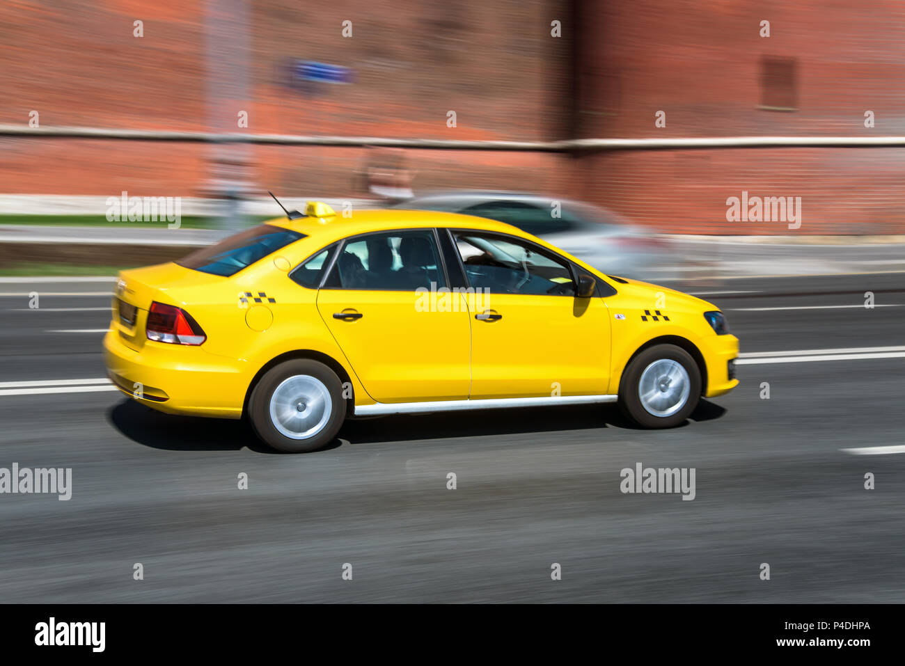 Abstract motion of a city street scene with a yellow taxi Stock Photo ...