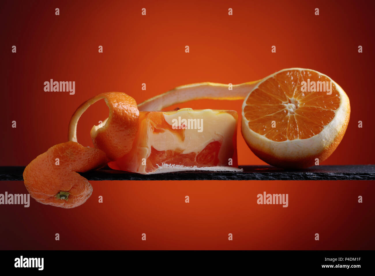 Bar of natural organic soap with orange on a orange background ...