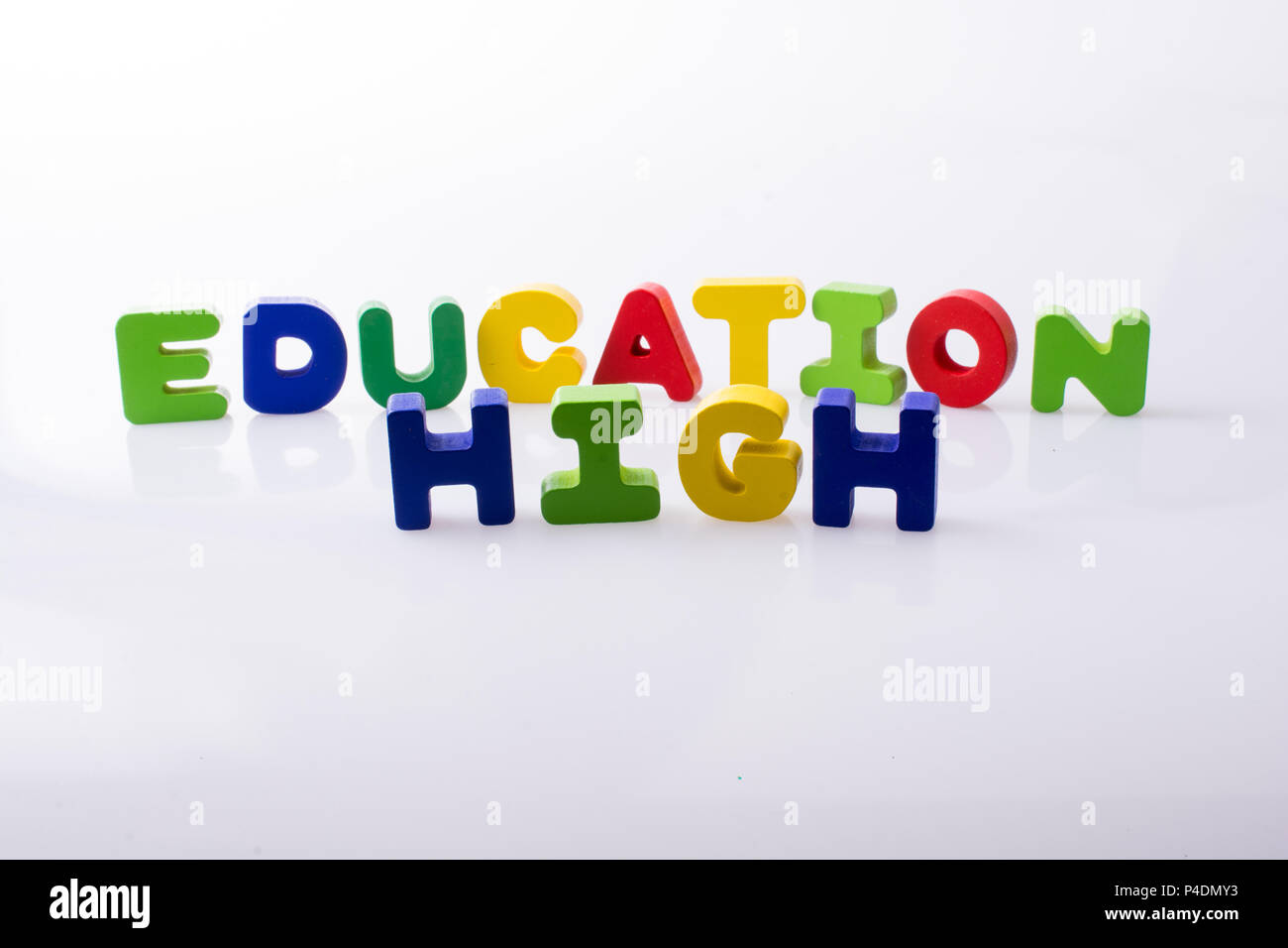 the word HIGH EDUCATION written with colorful letter blocks Stock Photo ...