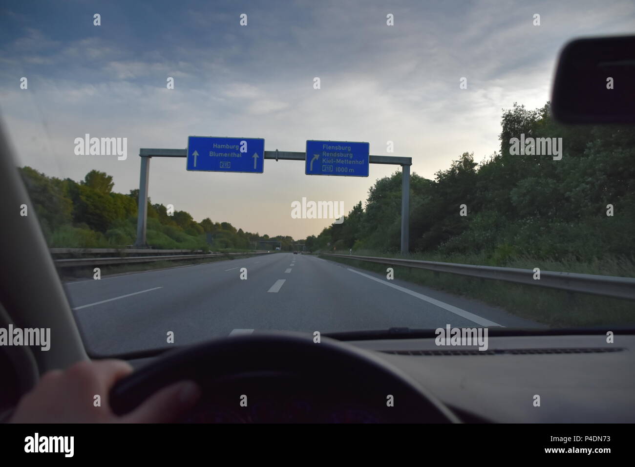 Car driver perspective on road in summer and winter Stock Photo - Alamy