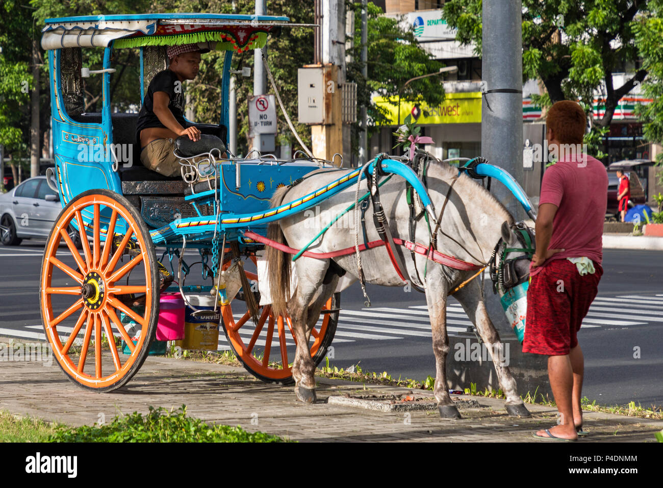 Kalesa on Roxas Boulevarde, Manila, Phlippines Stock Photo - Alamy