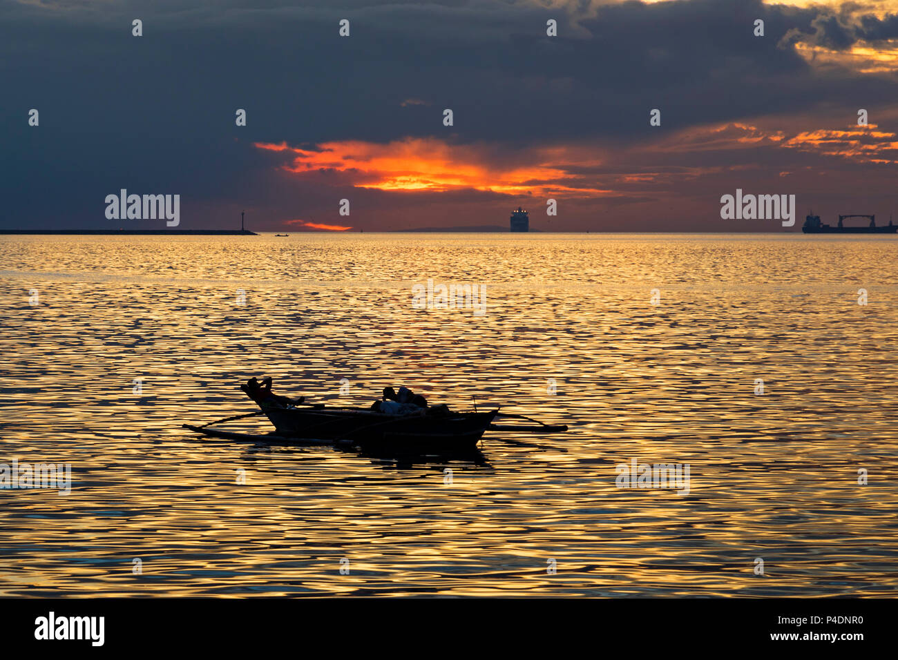 Fishing boat on Manila Bay at sunset, Philippines Stock Photo - Alamy