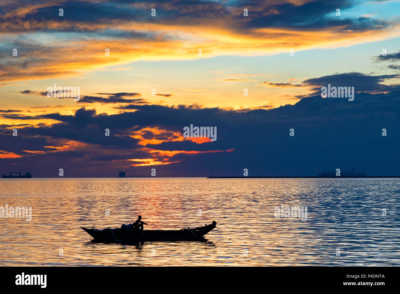 Fishing boat on Manila Bay at sunset, Philippines Stock Photo - Alamy
