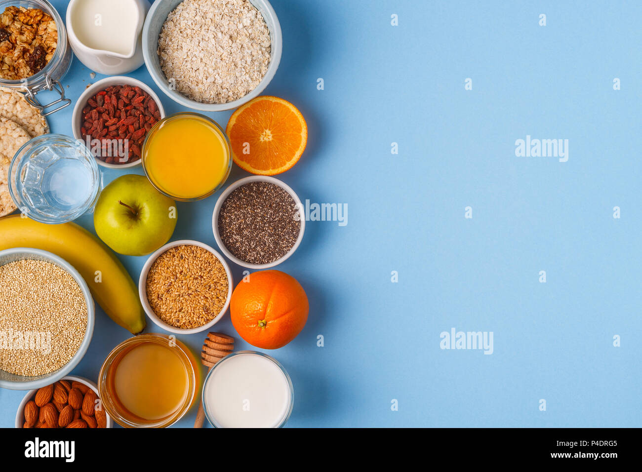 Useful breakfast on a blue pastel background, top view Stock Photo - Alamy