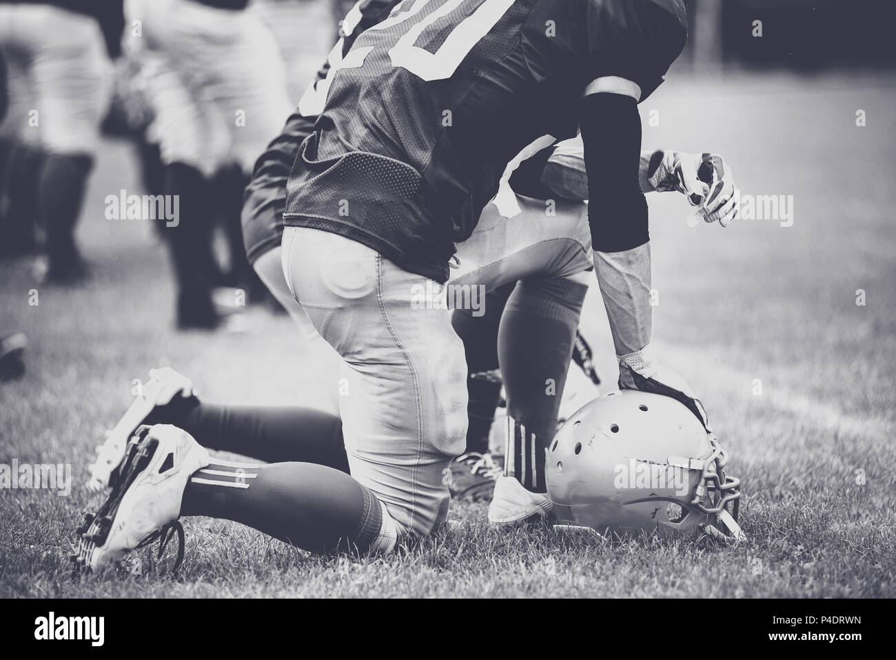 Duo toned image of American Football players in action Stock Photo - Alamy