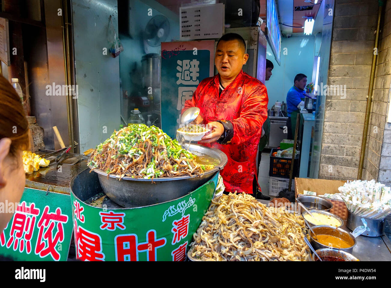 BEIJING, CHINA - MARCH 11, 2016: Food vendors offers its products at ...