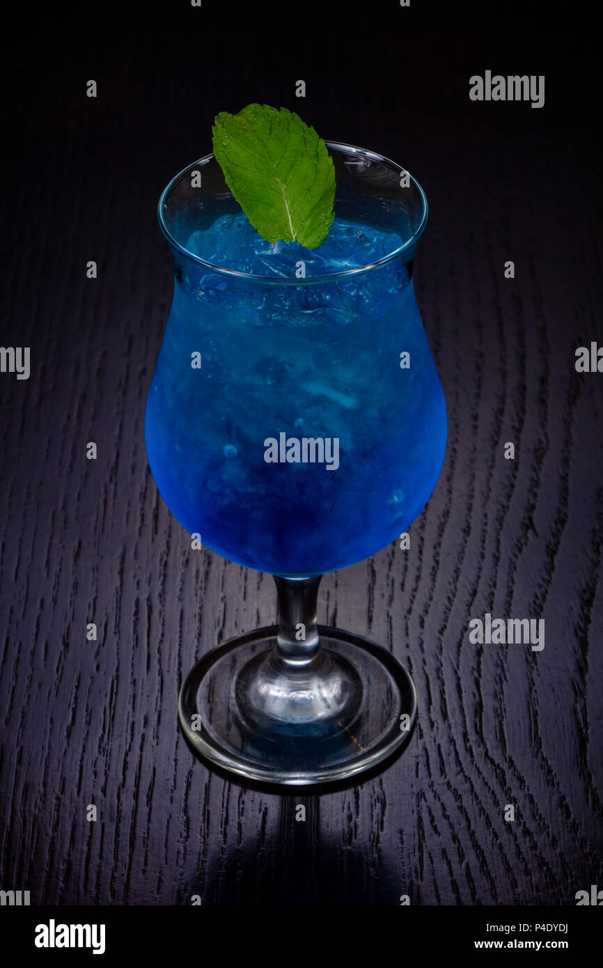 Sweet blue curacao cocktail with mint Stock Photo - Alamy