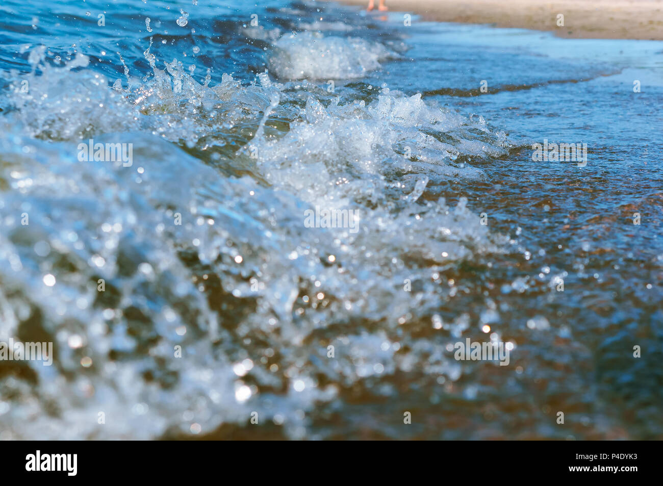 sea water foam, sea wave, the excitement on the shore sea, the water is ...