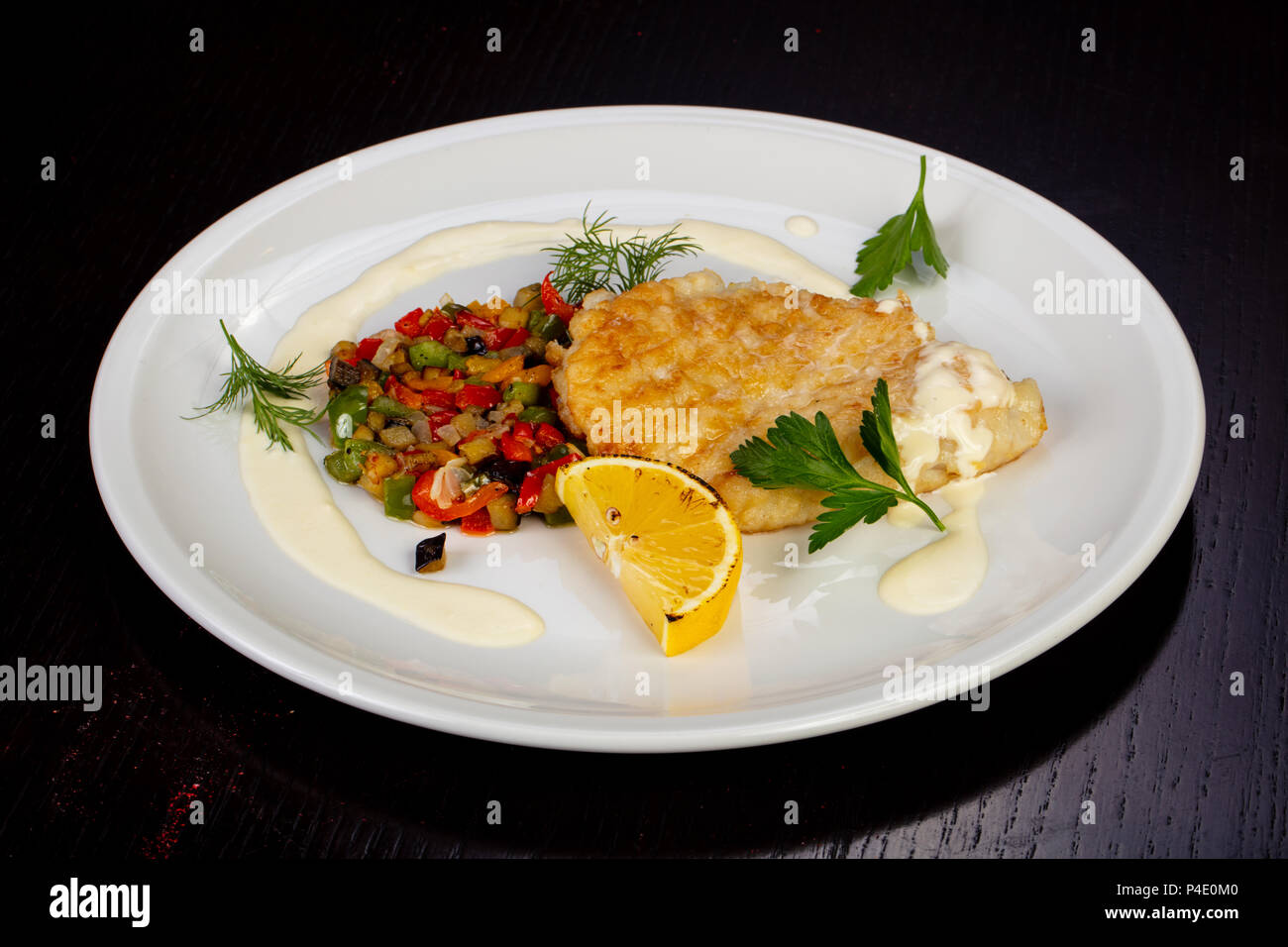 Tasty fried cod with lemon Stock Photo - Alamy