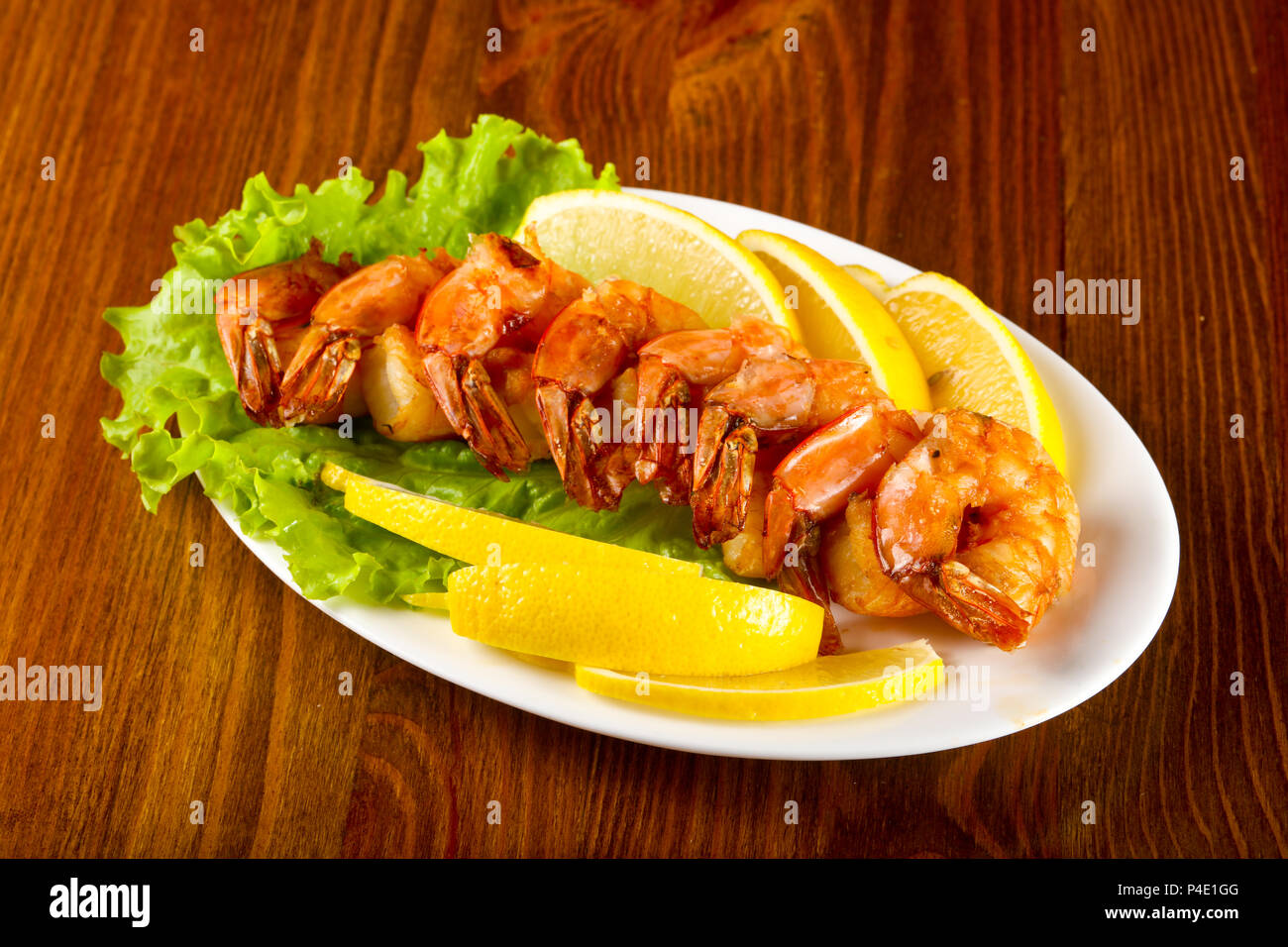 Grilled prawns served lemon Stock Photo - Alamy