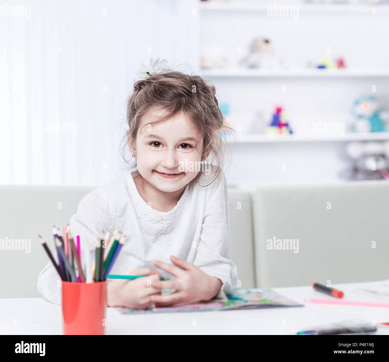 children's creativity. portrait of girl drawing with pencils ...