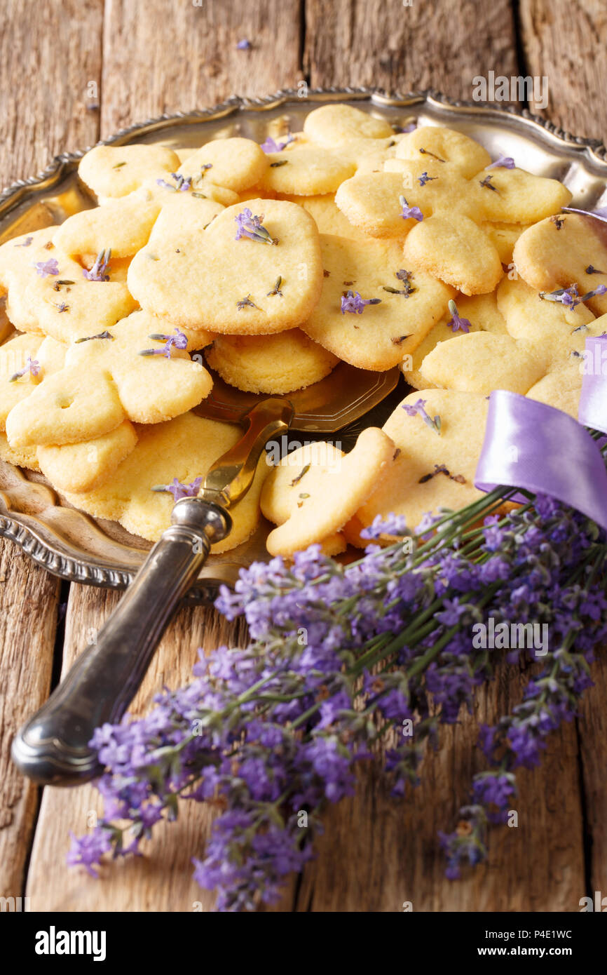 Delicious lavender shortbread cookie closeup on a plate on a table. vertical Stock Photo - Alamy