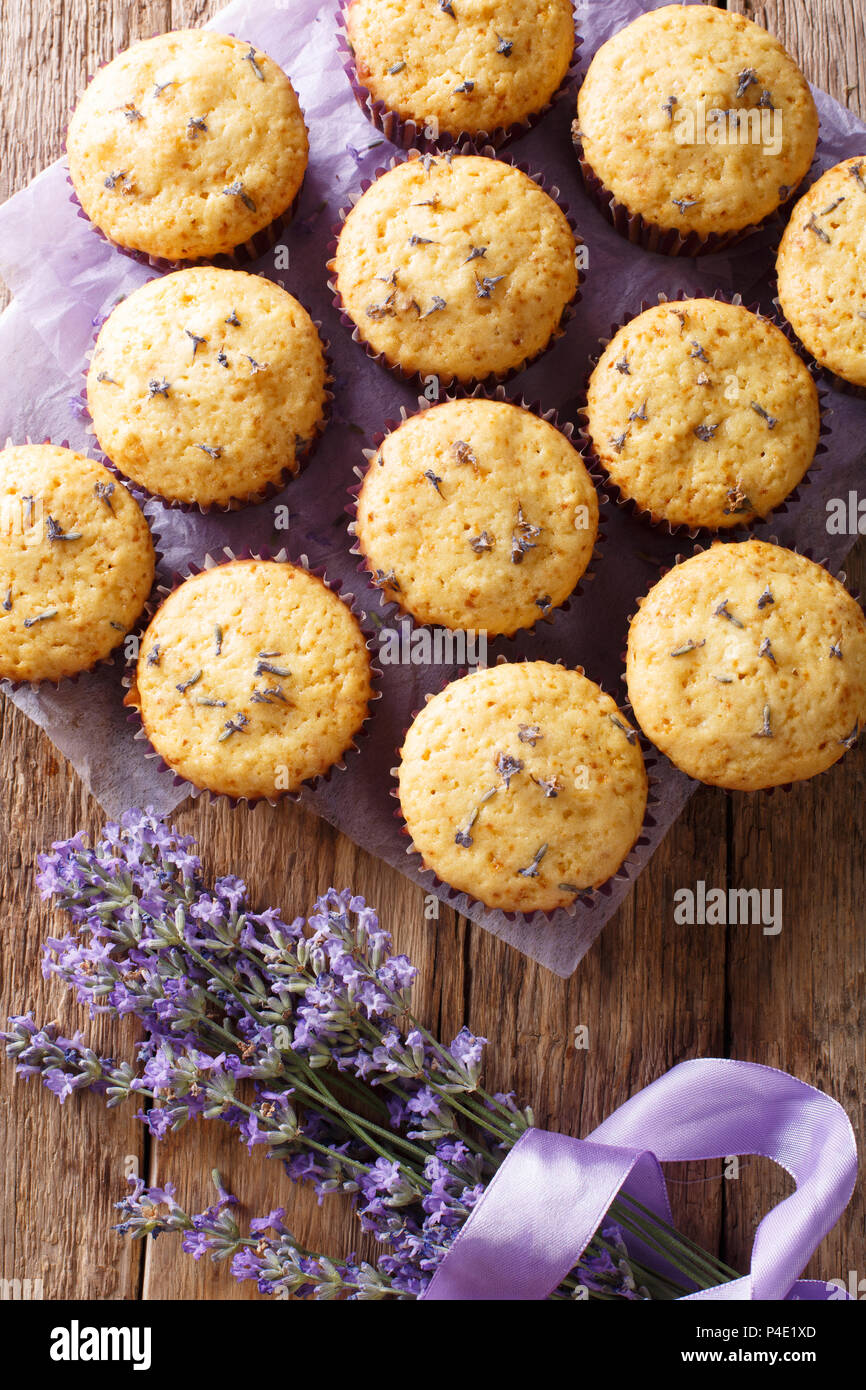 Organic tasty muffins with lavender flowers close-up on the table ...