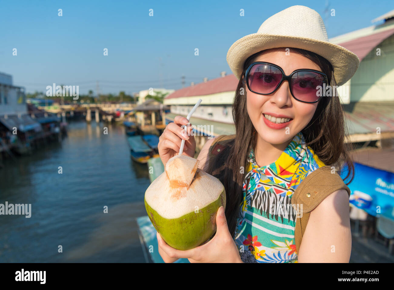 Asian Female Drinks The Coconut Drink To Cool Down Her Temperature