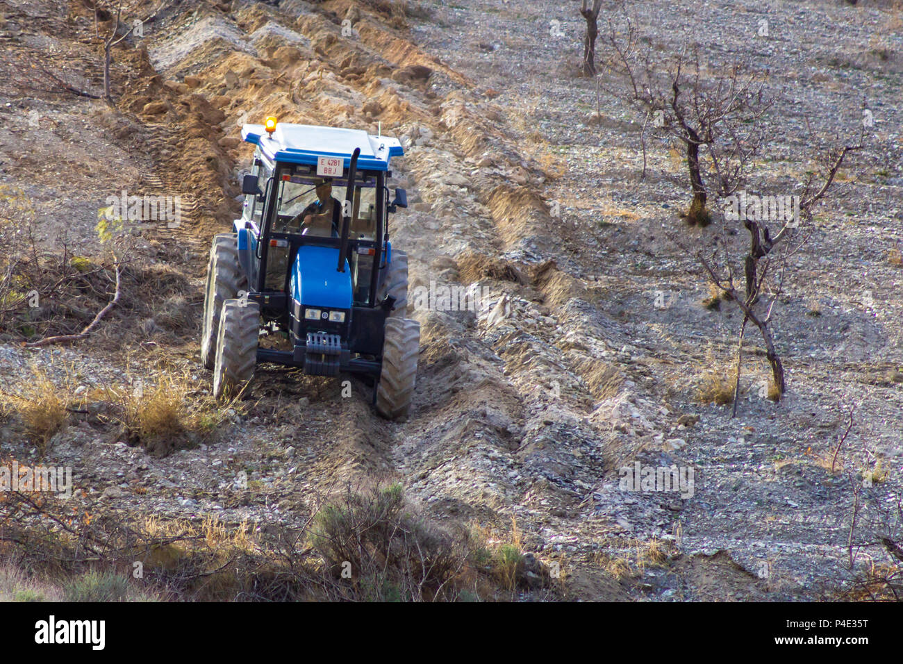 New Holland TL90 Tractor ploughing with a single furrow deep plough ...