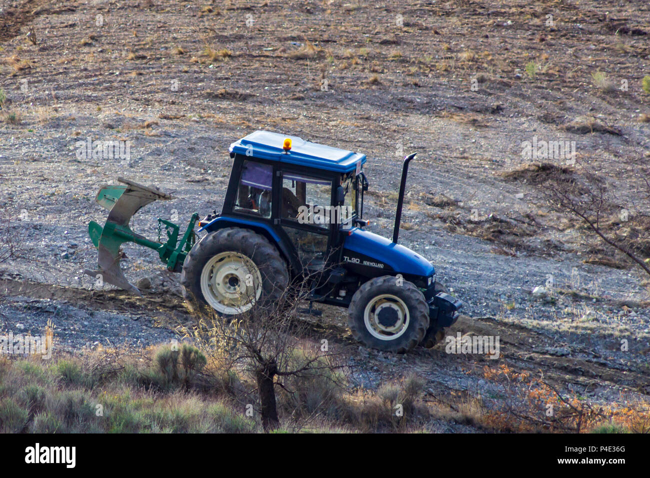 New Holland TL90 Tractor ploughing with a single furrow deep plough ...