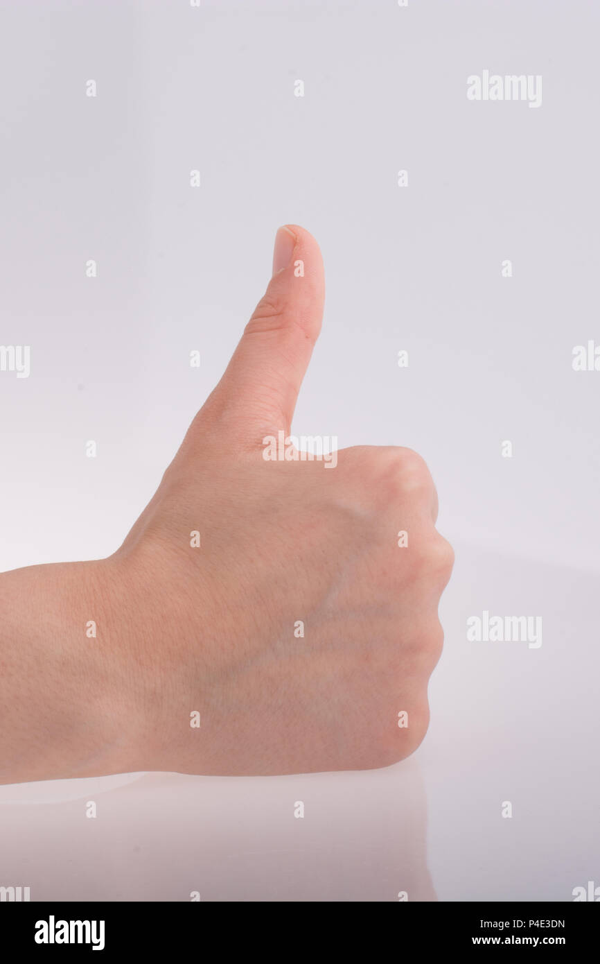 Hand making a good gesture on a white background Stock Photo - Alamy