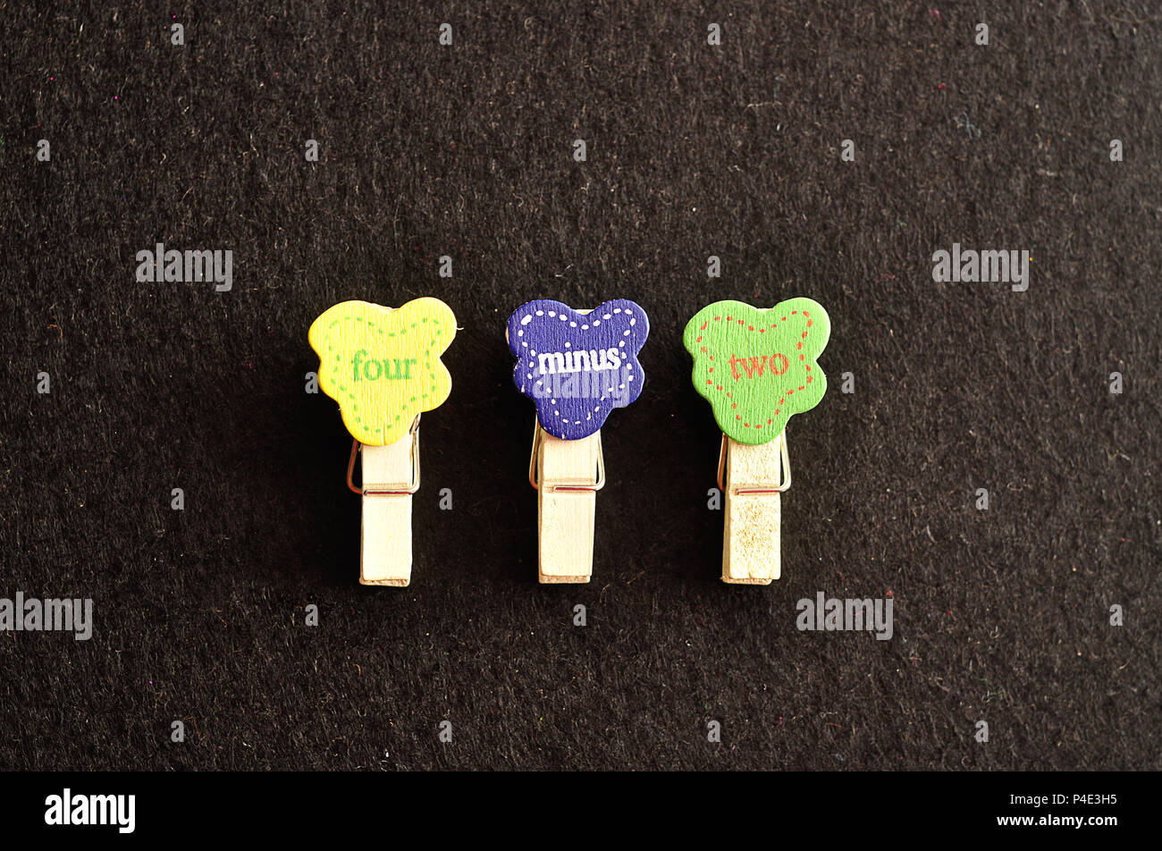 Four minus two on a black background Stock Photo - Alamy