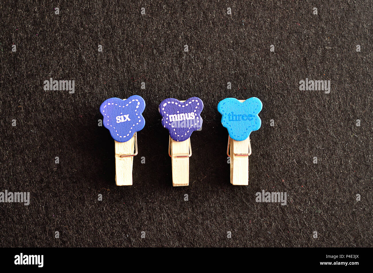 Six minus three on a black background Stock Photo - Alamy