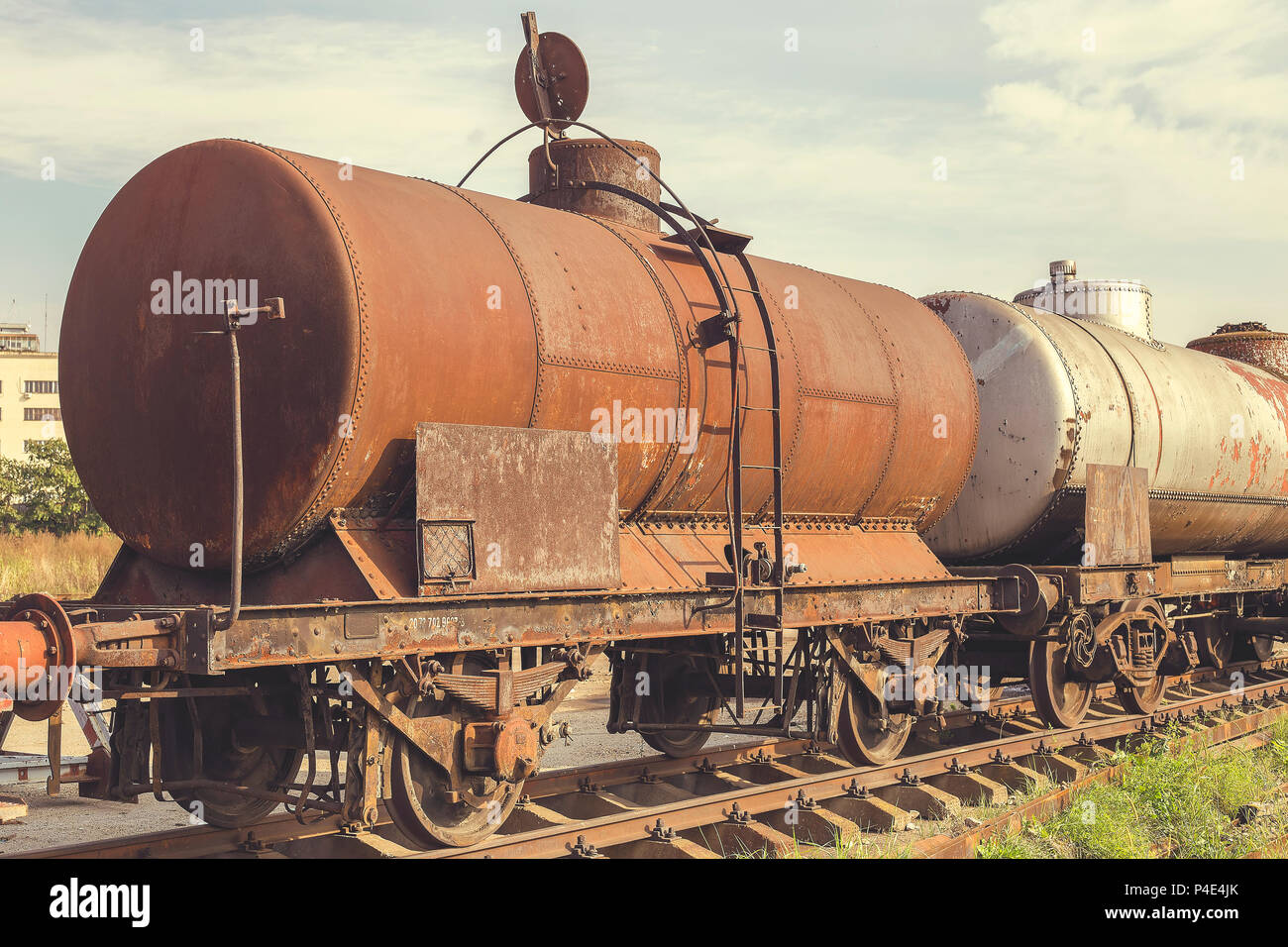 Abandoned rusty railway containers for as and oil transportation ...