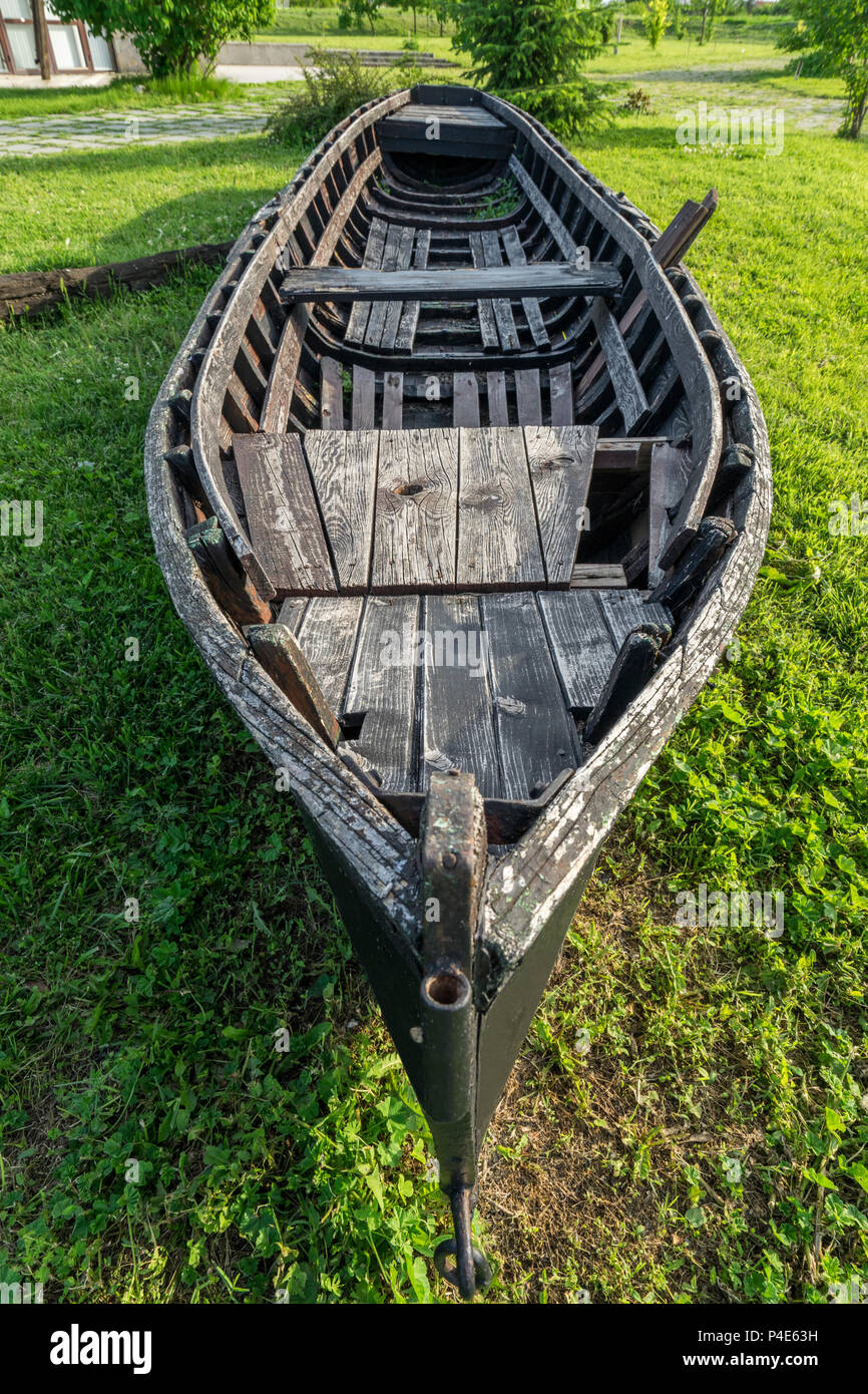 Old wooden boat abandoned on the shore Stock Photo - Alamy