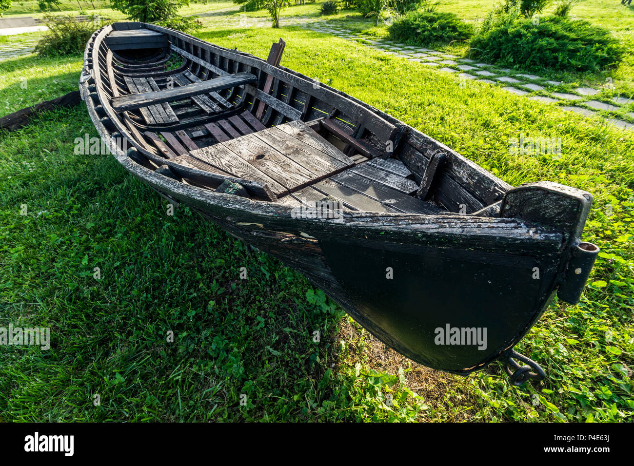Old wooden boat abandoned on the shore Stock Photo - Alamy