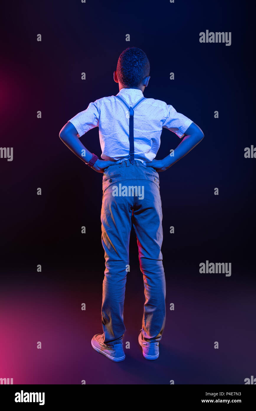 Slim schoolboy having his hands on his waist Stock Photo - Alamy