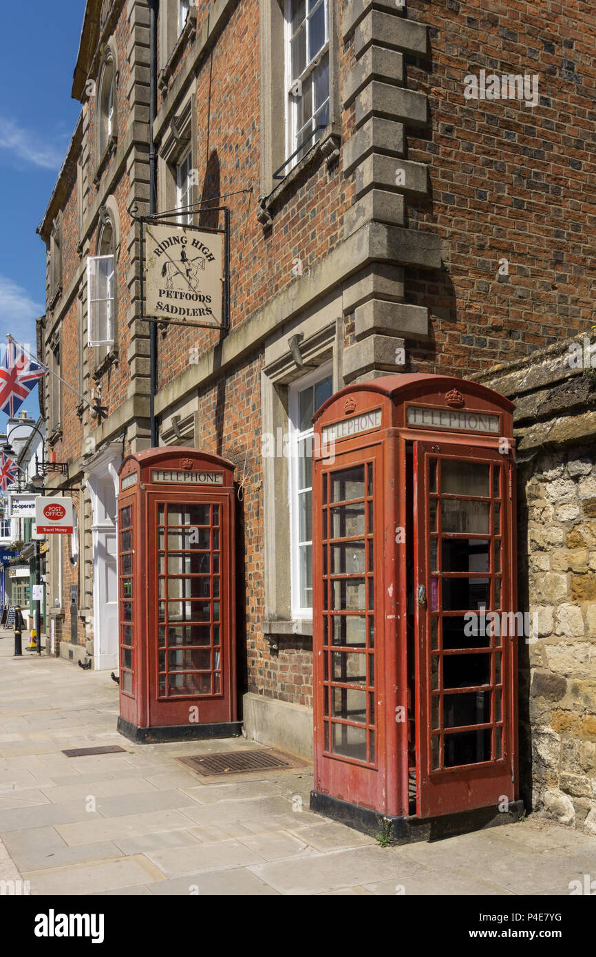 Two old red telephone boxes on the Market Square in the historic market ...