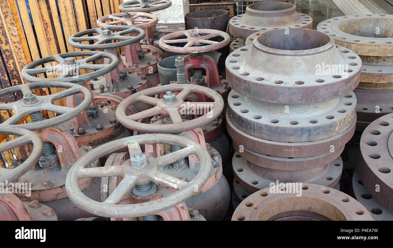 A collection of massive ship valves with large handwheels Stock Photo ...