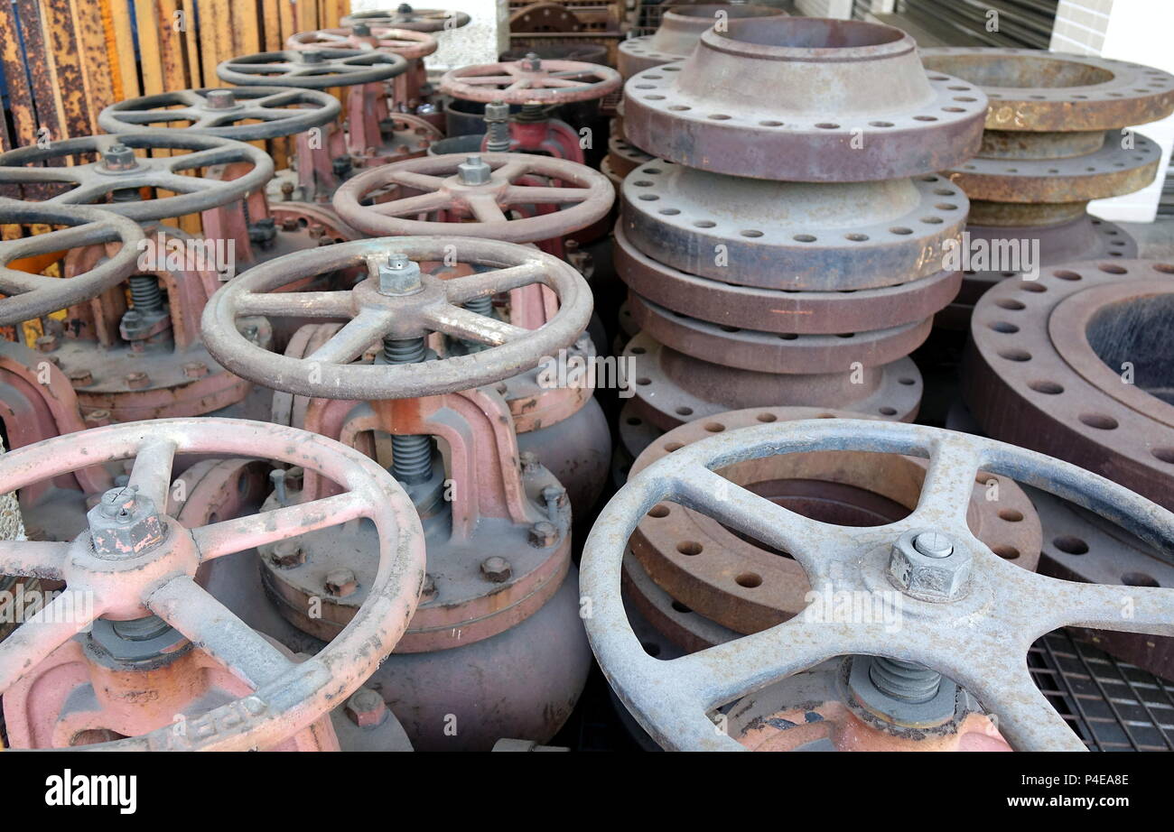 A collection of massive ship valves with large handwheels Stock Photo ...
