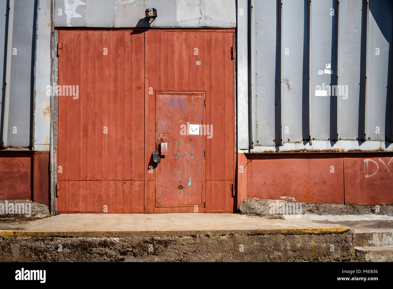 Old metal warehouse door, hangar gate. Industrial iron door Stock Photo ...