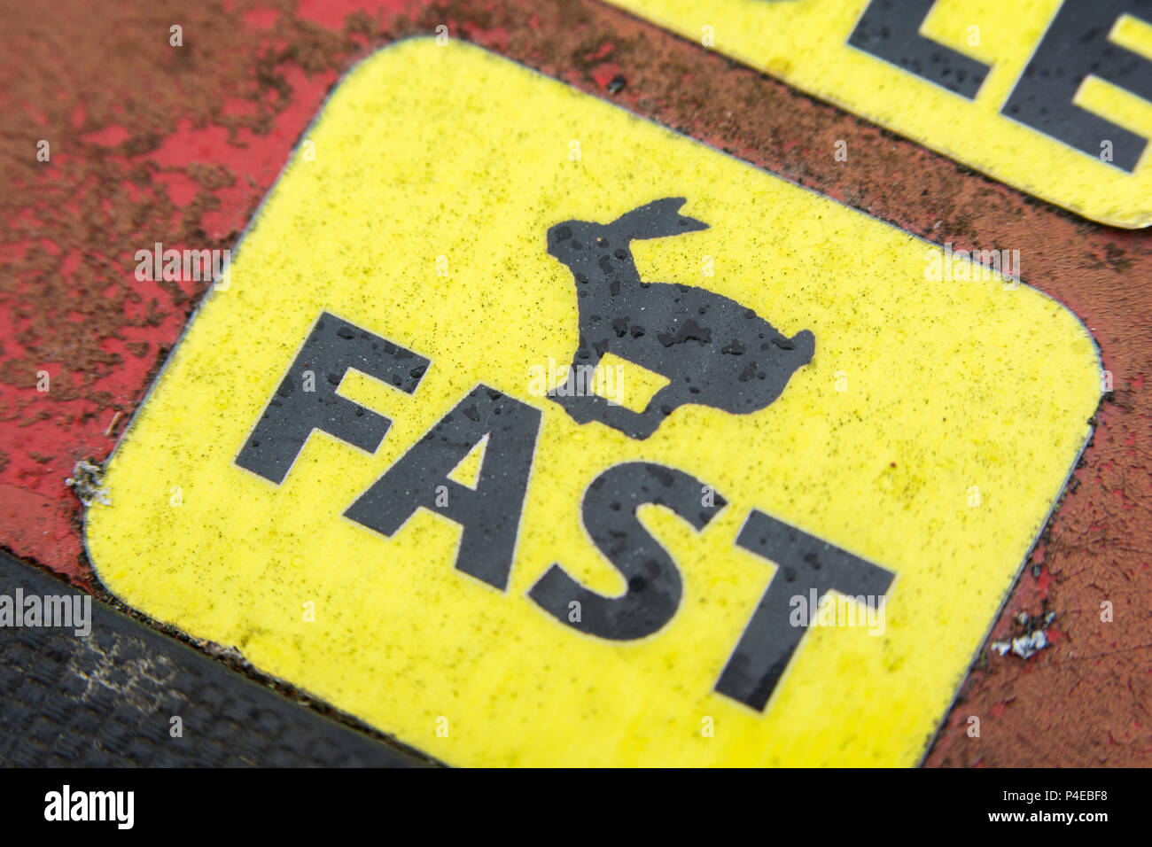 Engine management labels on tractor bodywork. Metaphor for tortoise and ...