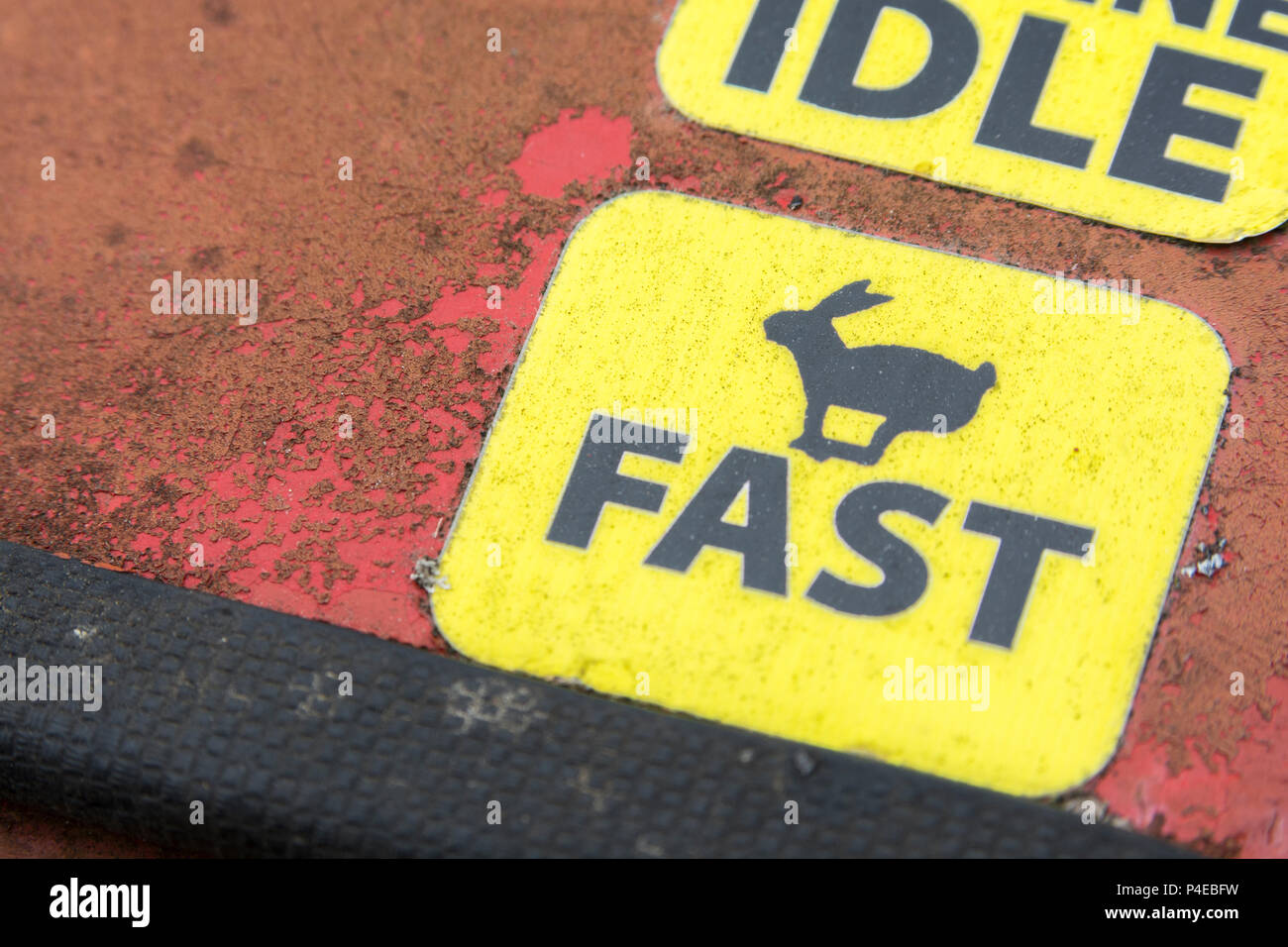 Engine management labels on tractor bodywork. Metaphor for tortoise and ...