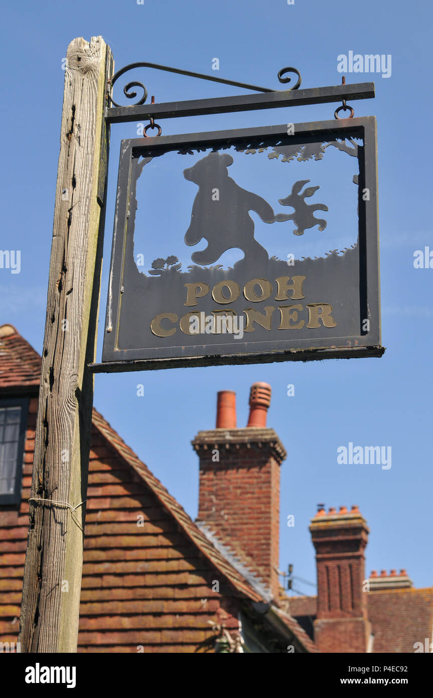 Pooh Corner sign in the Kent Village of Hartfield, UK. Warm blue skies ...
