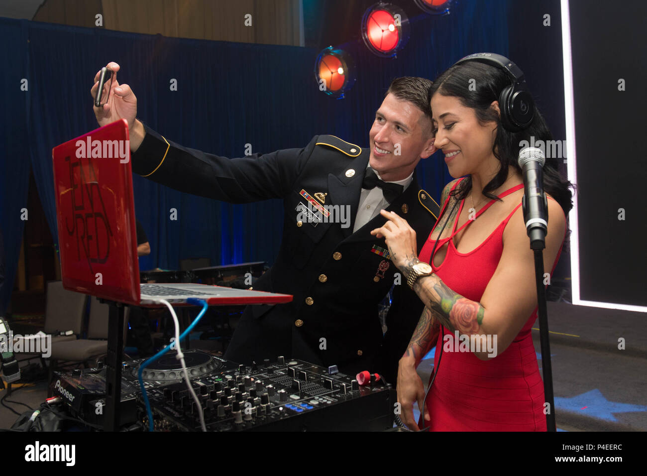 A soldier takes a selfie with DJ Jena Red during the 243rd Army ...