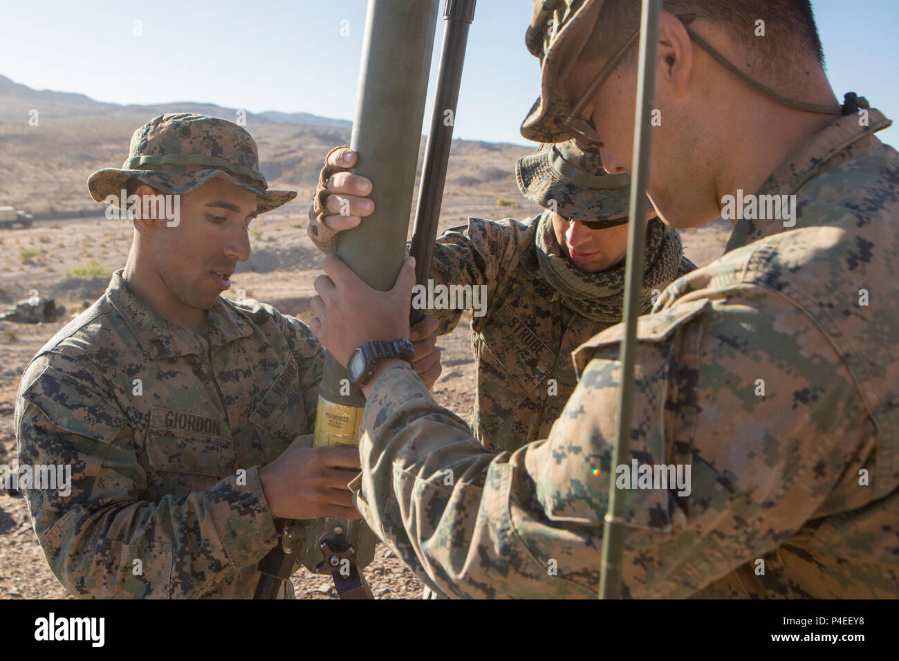 Lance Cpl. Andre Giordon (left) and Lance Cpl. Benjamin Strube (center ...