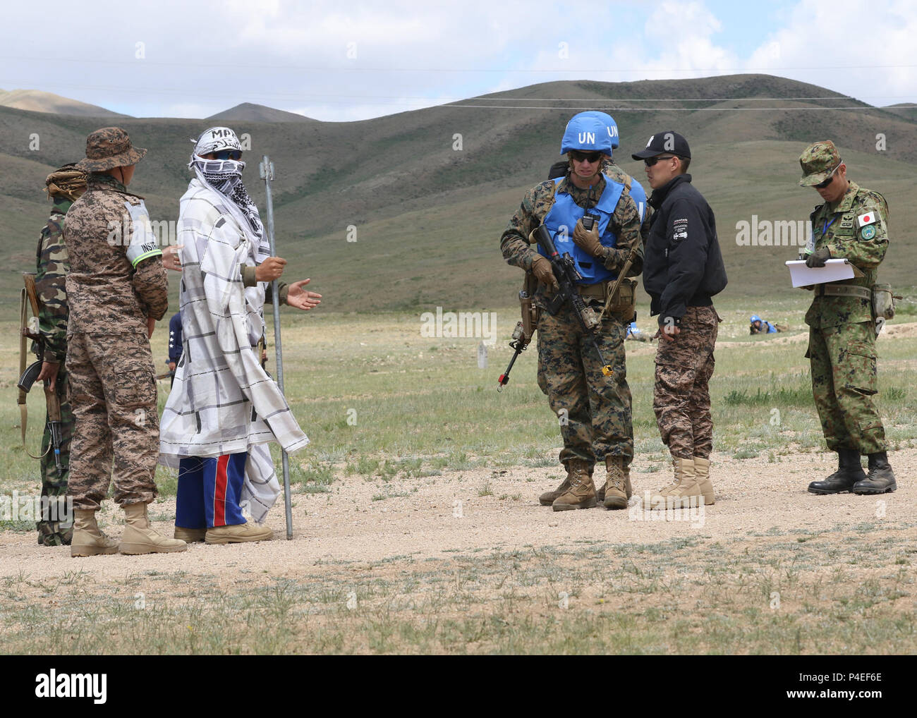 U.S. Marine Corps Forces Pacific Marines speak with civilians with the ...