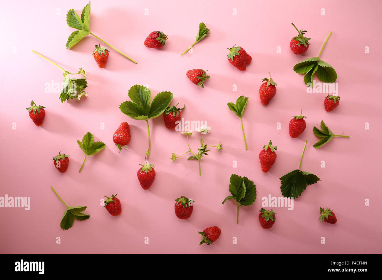 Fresh strawberry pink background Stock Photo - Alamy