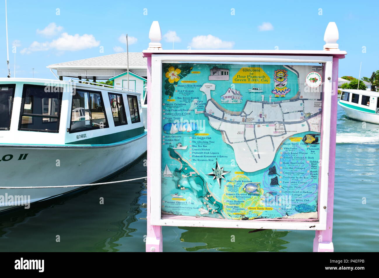 Welcoming sign and map for visitors of Green Turtle Cay at boat dock ...