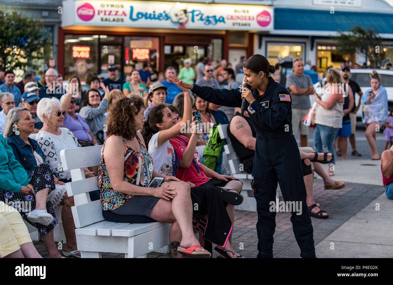 Tech. Sgt. Nalani Quintello, Max Impact vocalist, gives a high five to ...