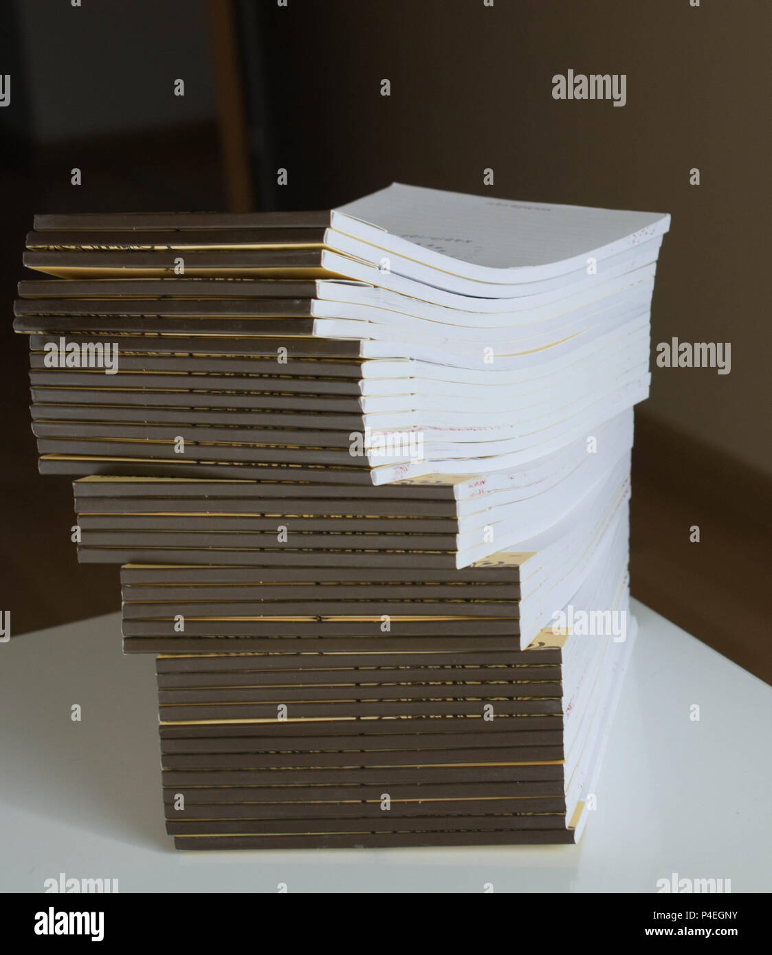 Great number of empty notebooks pile up Stock Photo - Alamy