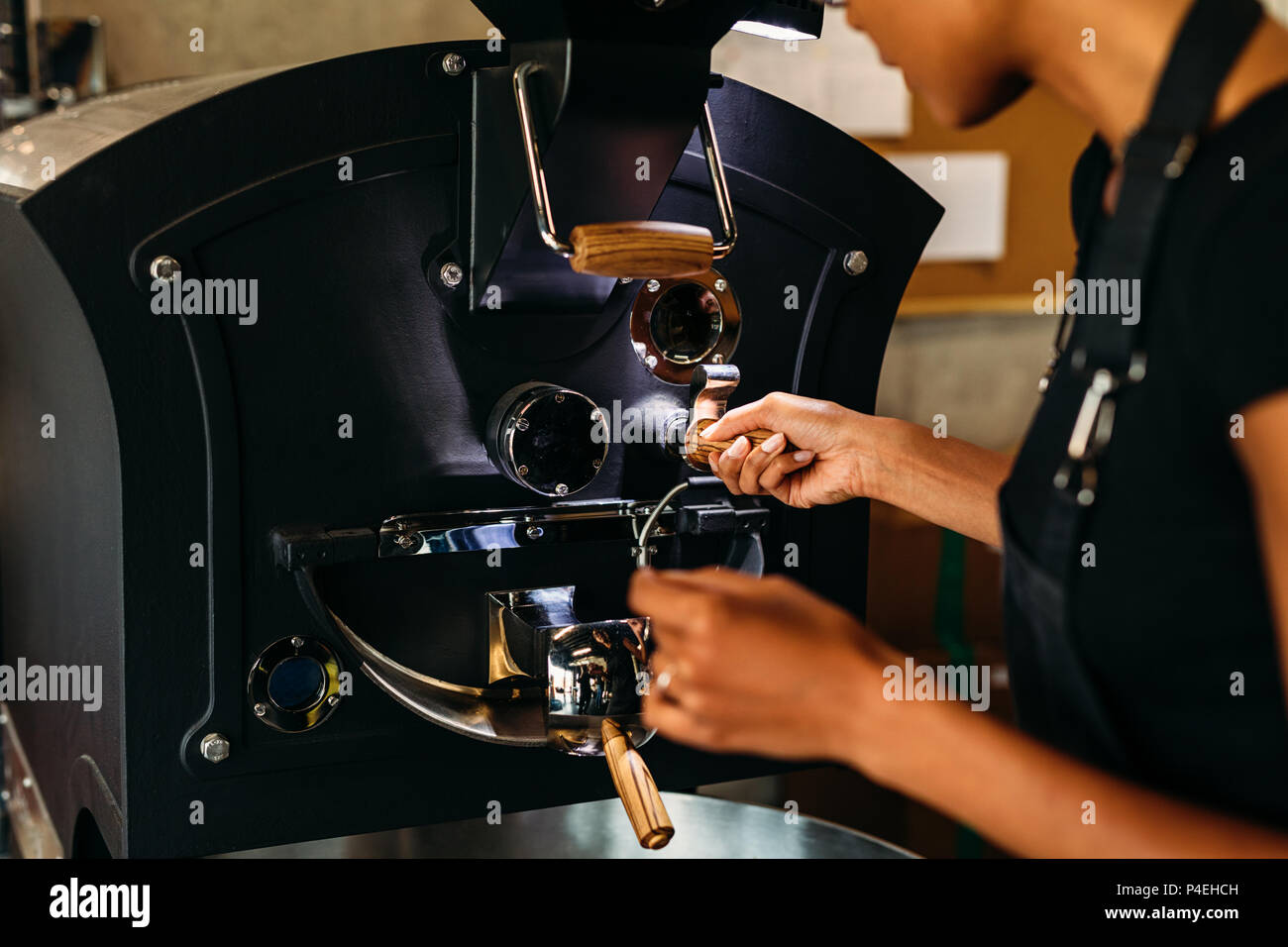 Person operating a coffee roasting machine hi-res stock photography and ...