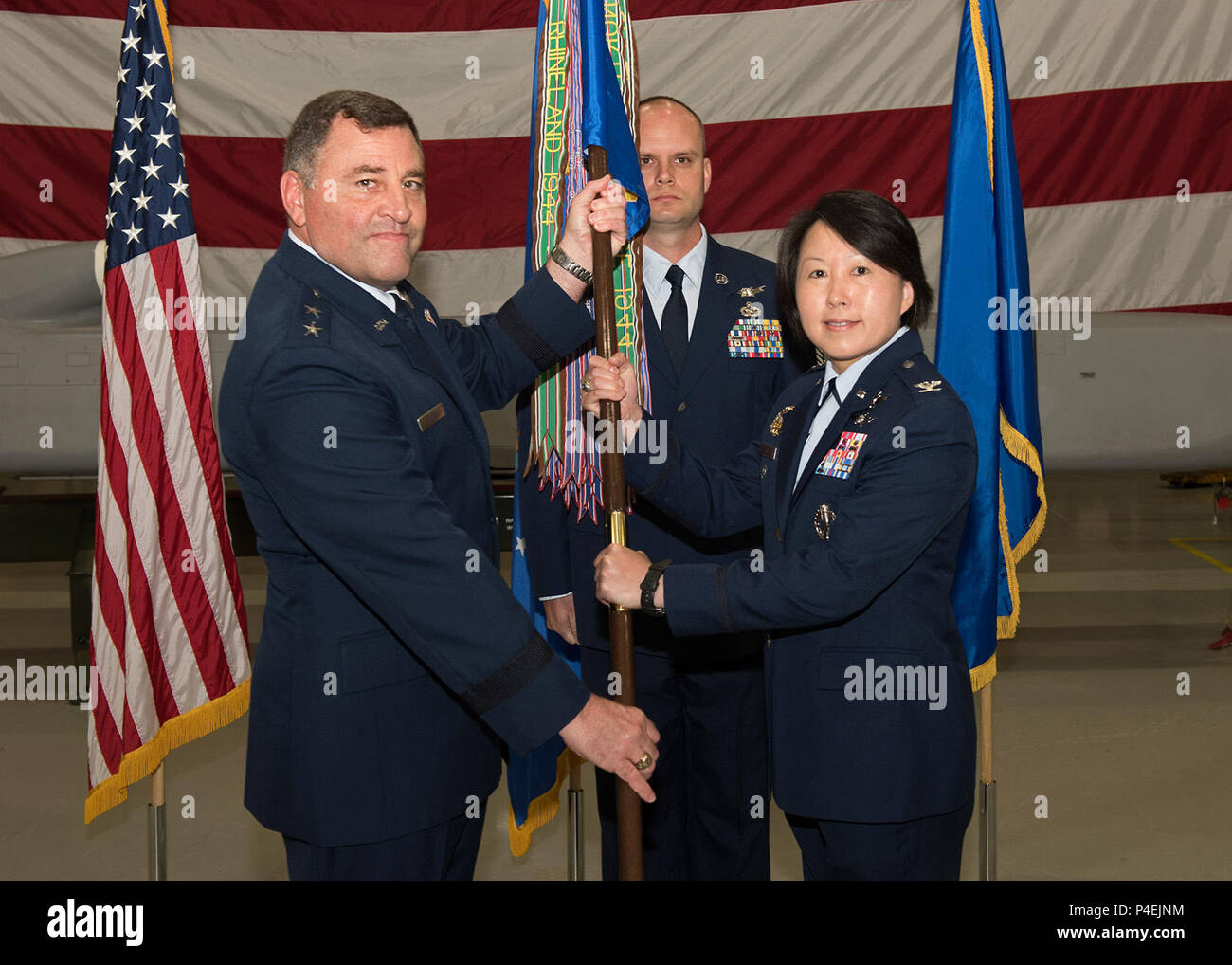 Maj. Gen. Timothy Leahy, 2nd Air Force commander, hands the guide-on to ...