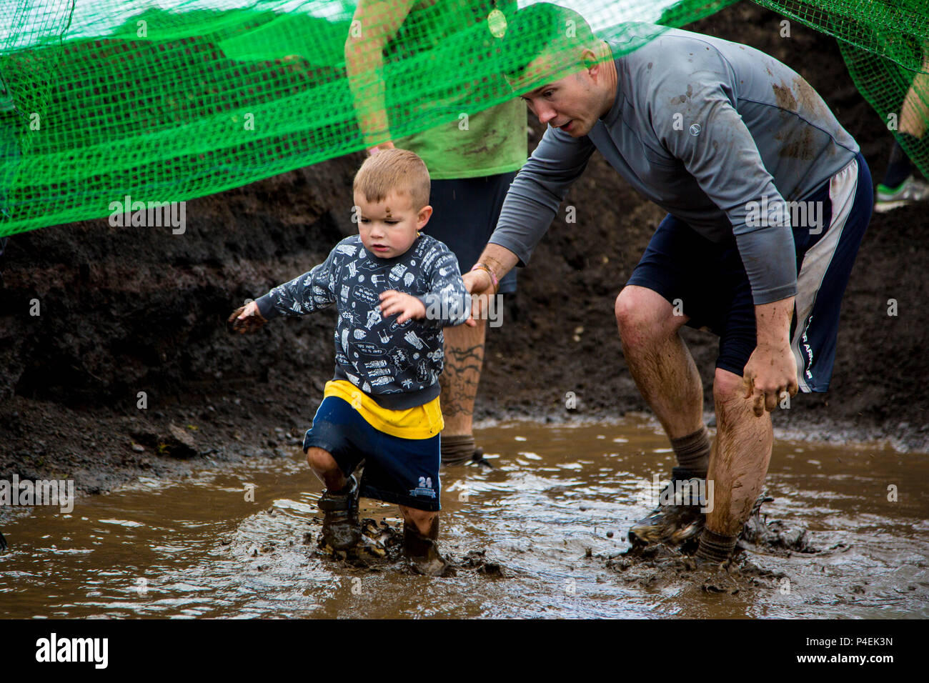 CAMP FUJI, SHIZUOKA, Japan- A service member encourages a child through ...