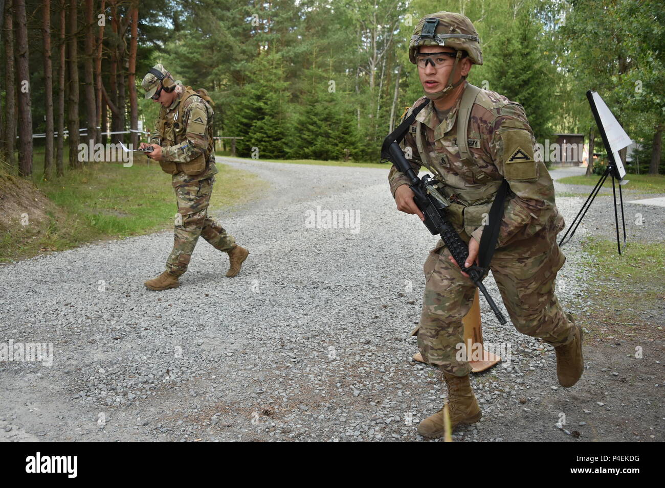 U.S. Army Staff Sgt. Cesar Gonzalez, right, assigned to 1st Battalion ...