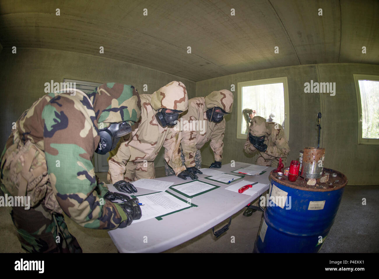 Competitors fill out an NBC report while in mission oriented protective ...