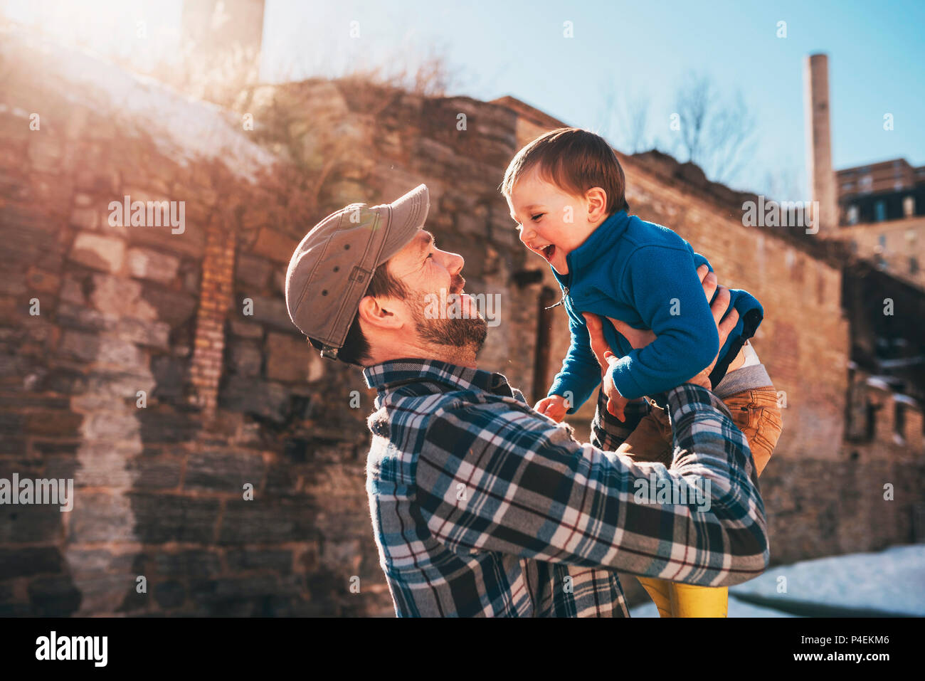 Lifting children hi-res stock photography and images - Alamy