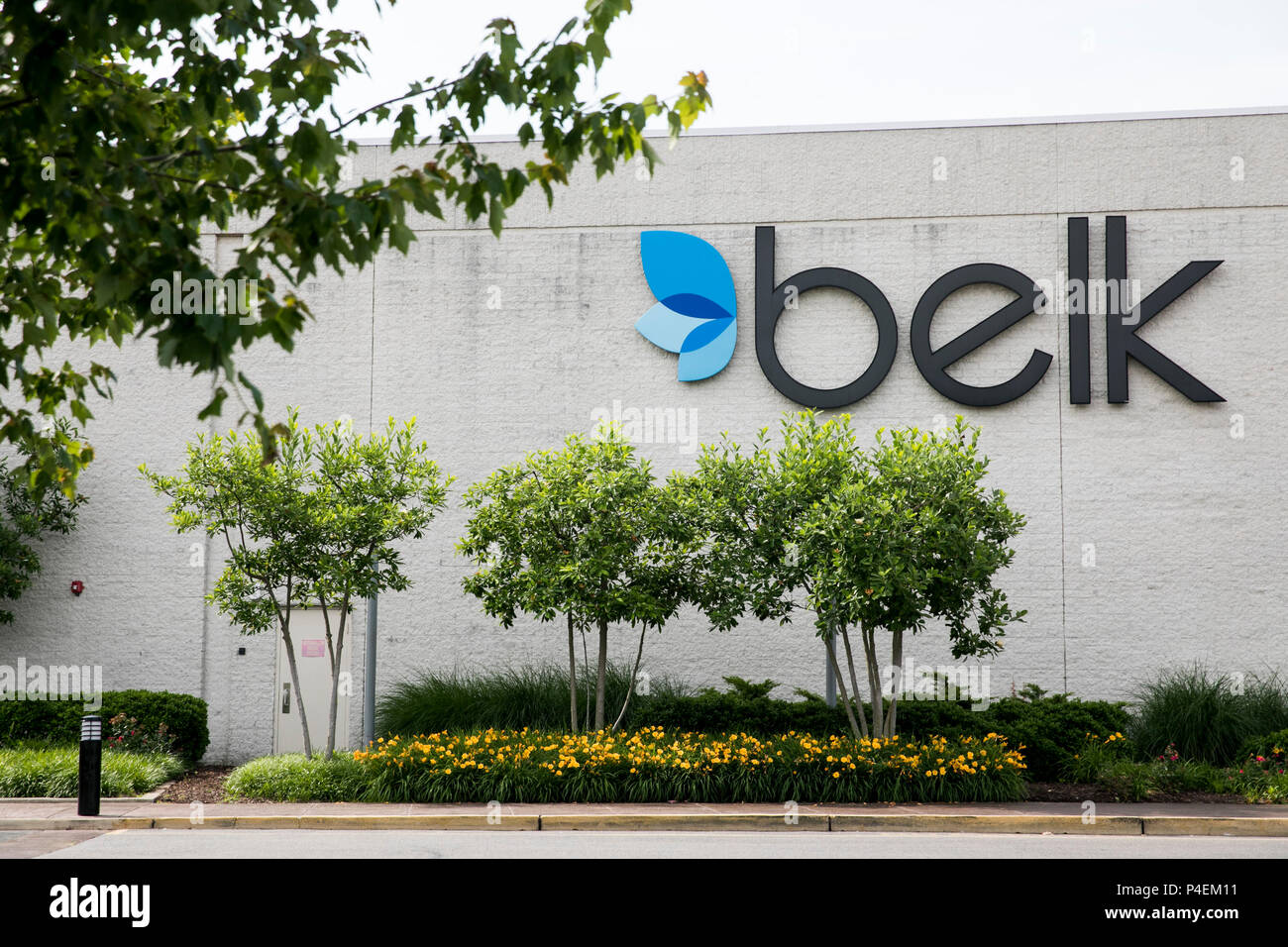 A logo sign outside of a Belk retail store in Fredericksburg, Virginia ...