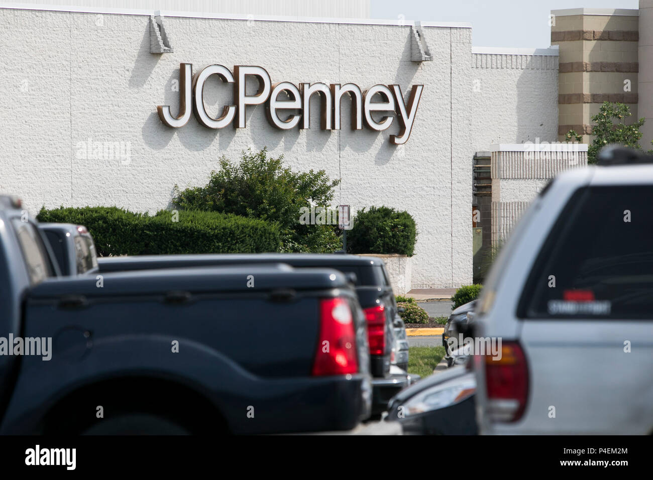 A logo sign outside of a JCPenney retail store in Fredericksburg ...