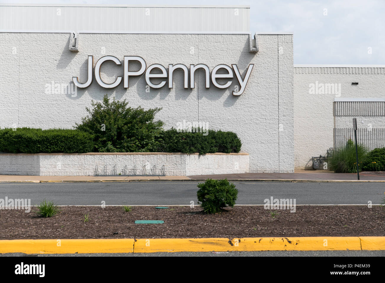 A logo sign outside of a JCPenney retail store in Fredericksburg ...